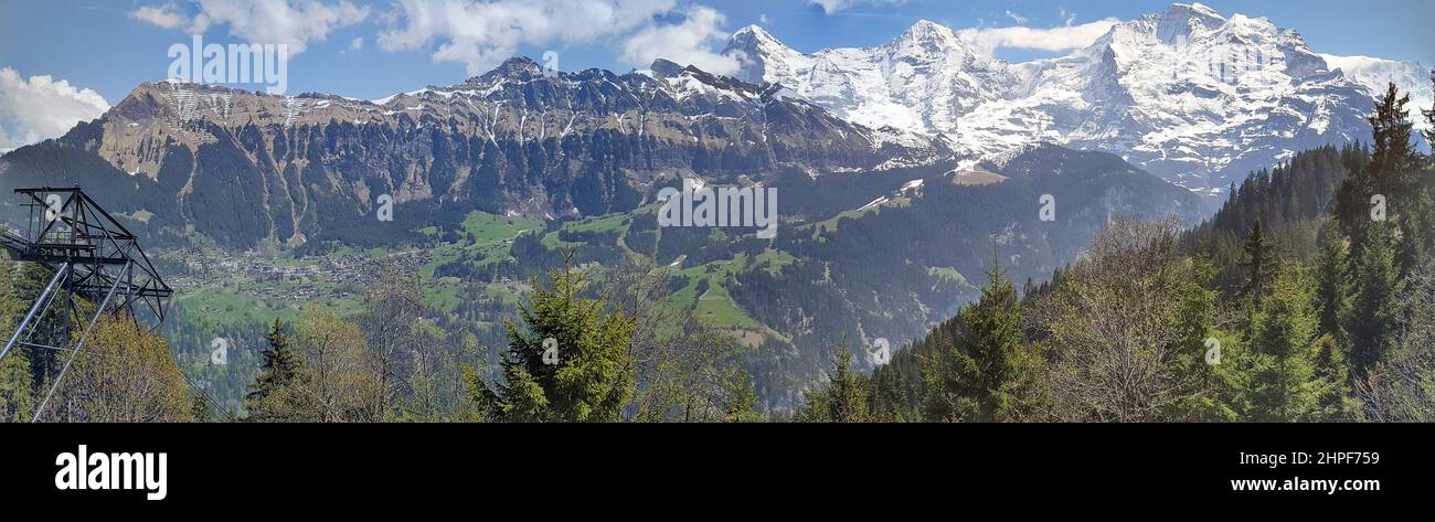 A panoramic view of the towering Swiss Jungfrau and Eiger overlooking ...