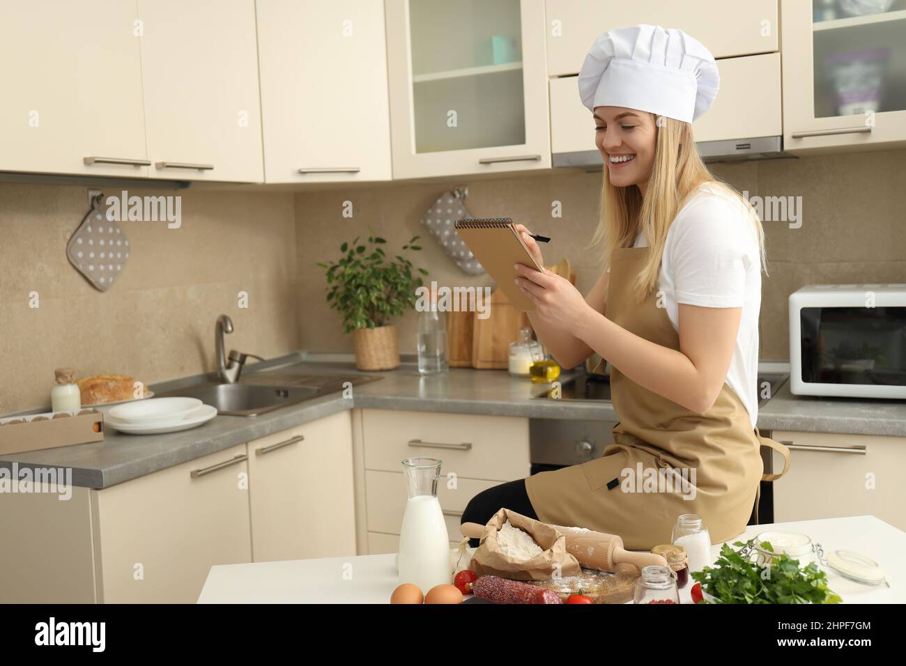 Concept of home cooking with female chef Stock Photo - Alamy