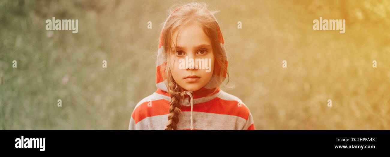 portrait face of upset or focused thoughtful scowl eight year old kid ...