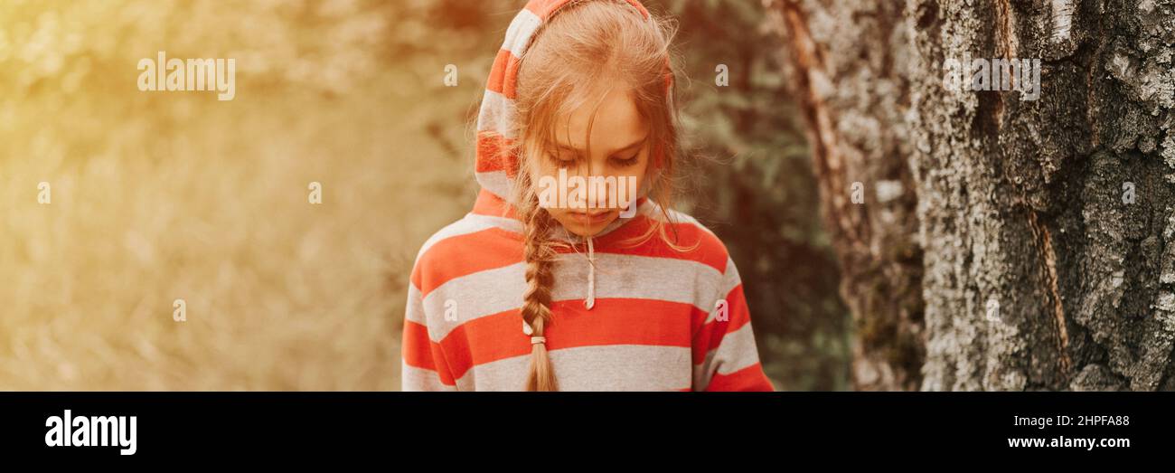 portrait face of upset or focused thoughtful scowl eight year old kid ...