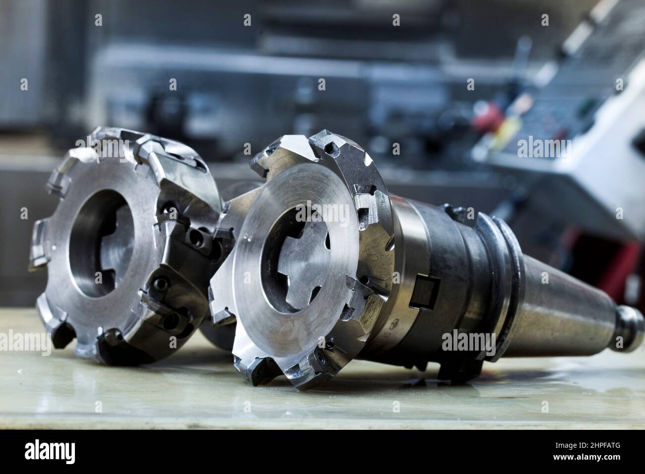 tools for milling metal on workbench in front of machines Stock Photo ...