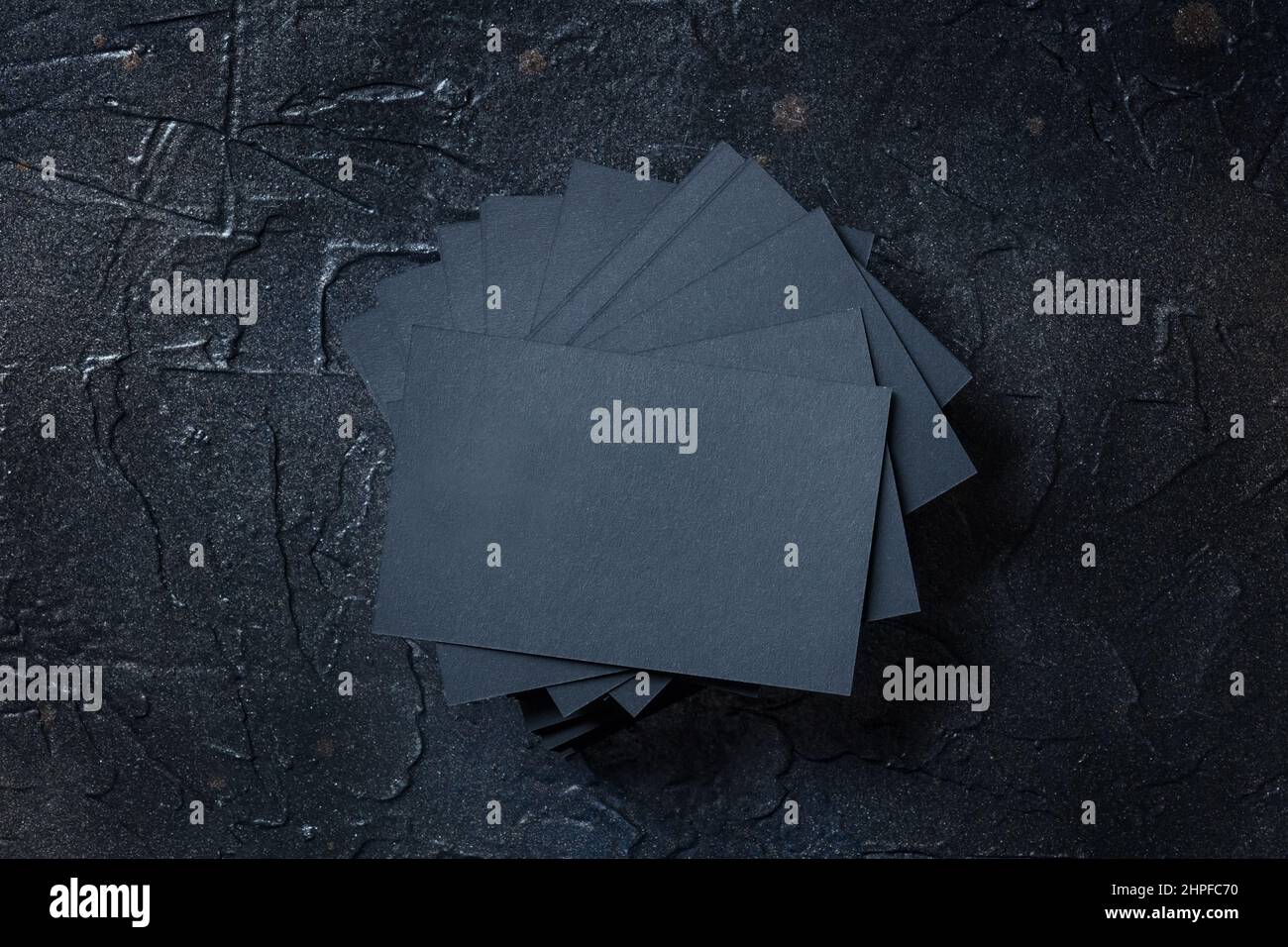 Black business card stack mockup on a dark background, a template for ...