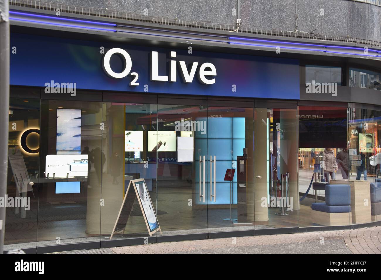 Cologne, Germany. 17th Feb, 2022. Logo, lettering of O2 Live on a store, telecommunication ...