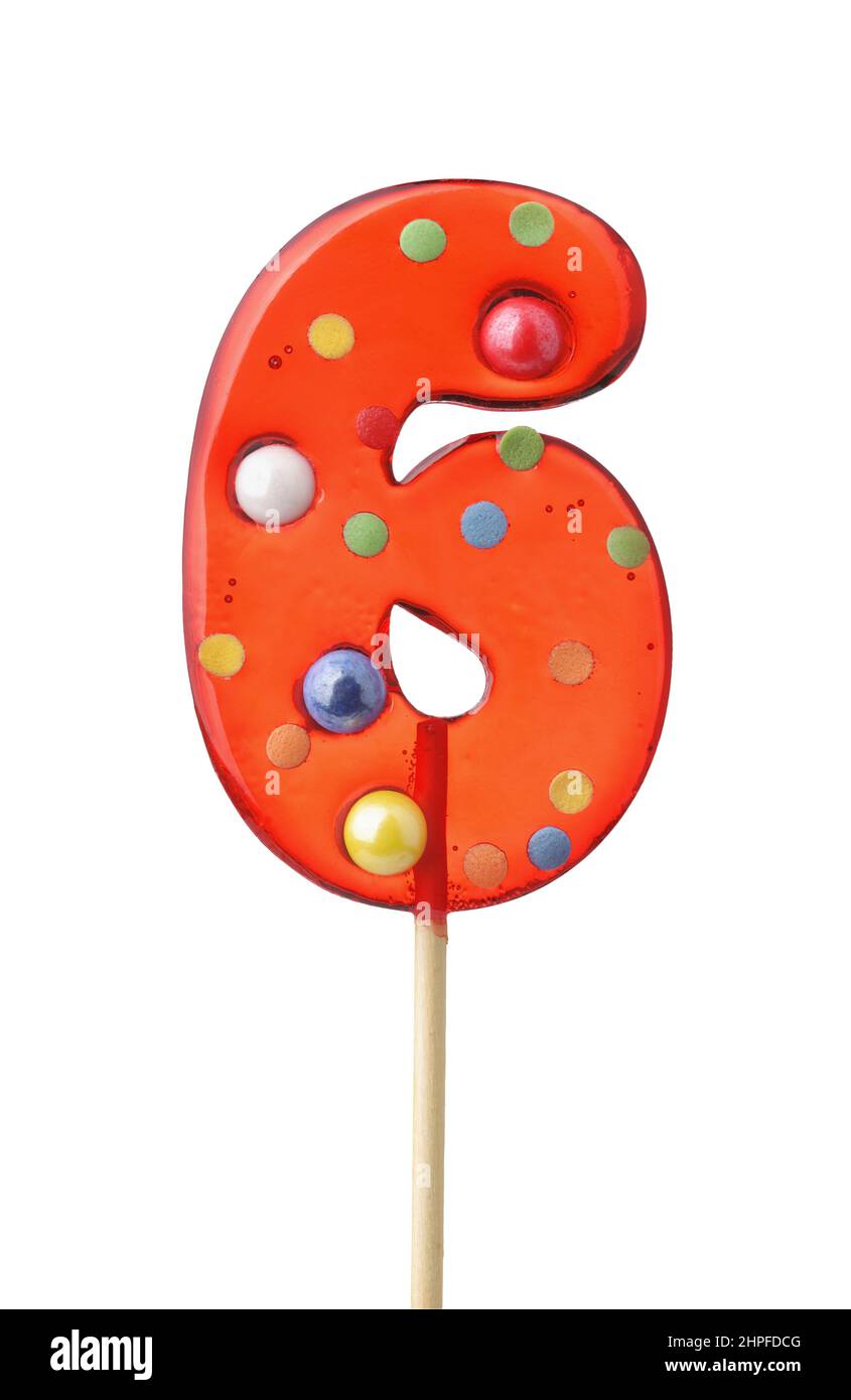 Front view of red transparent handmade number six lollipop isolated on ...