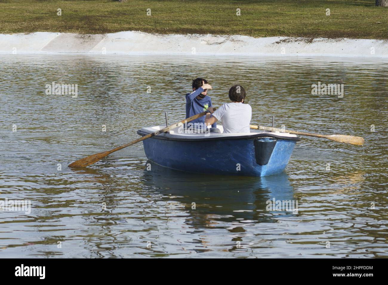 Kids riding in a rowboat in a Europe Park, Madrid, Spain Stock Photo ...