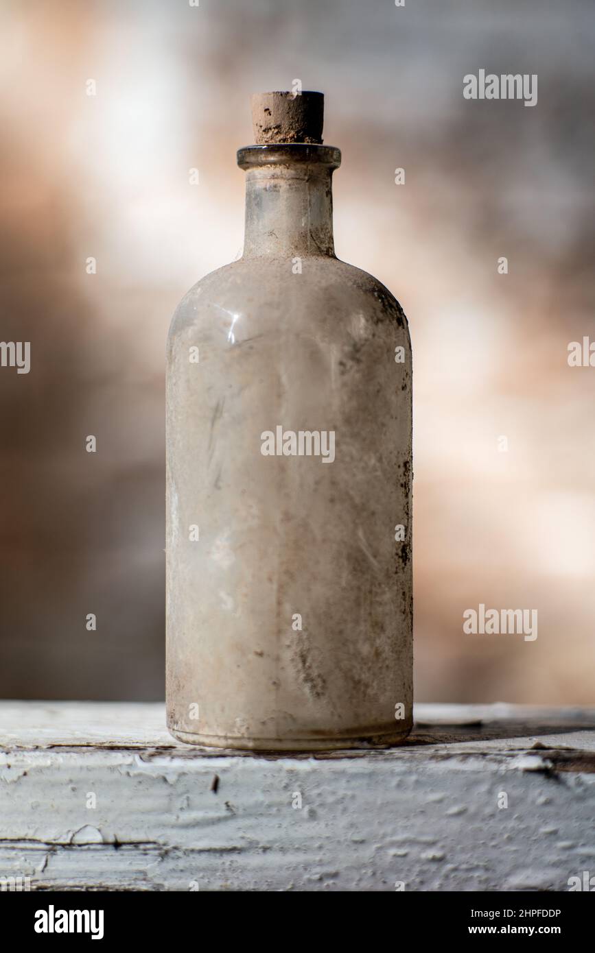 Opaque old bottle with cork Stock Photo - Alamy
