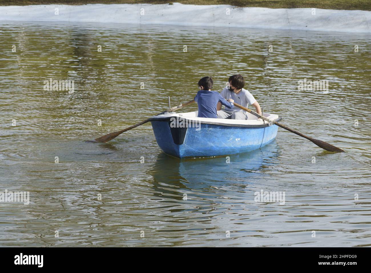 Kids riding in a rowboat in a Europe Park, Madrid, Spain Stock Photo ...