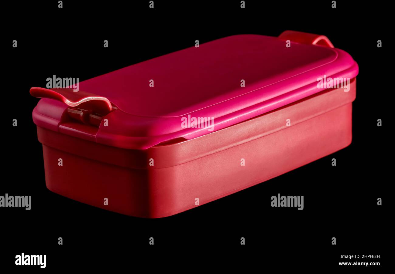 Red lunchbox made of plastic isolated in black back Stock Photo - Alamy