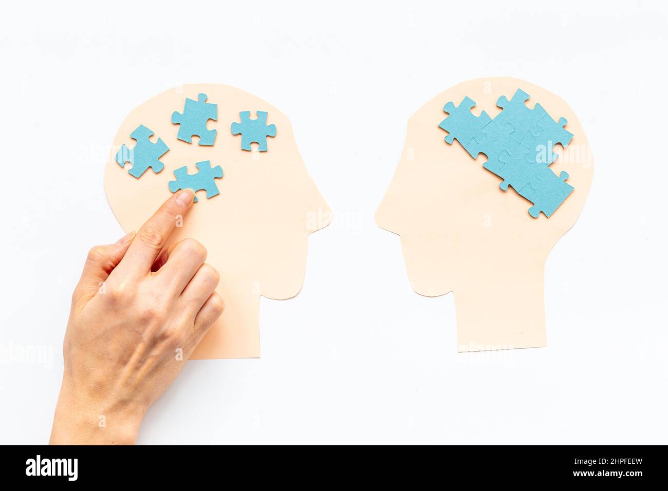 Communication. Chaos and peace in brain - two paper human heads with ...