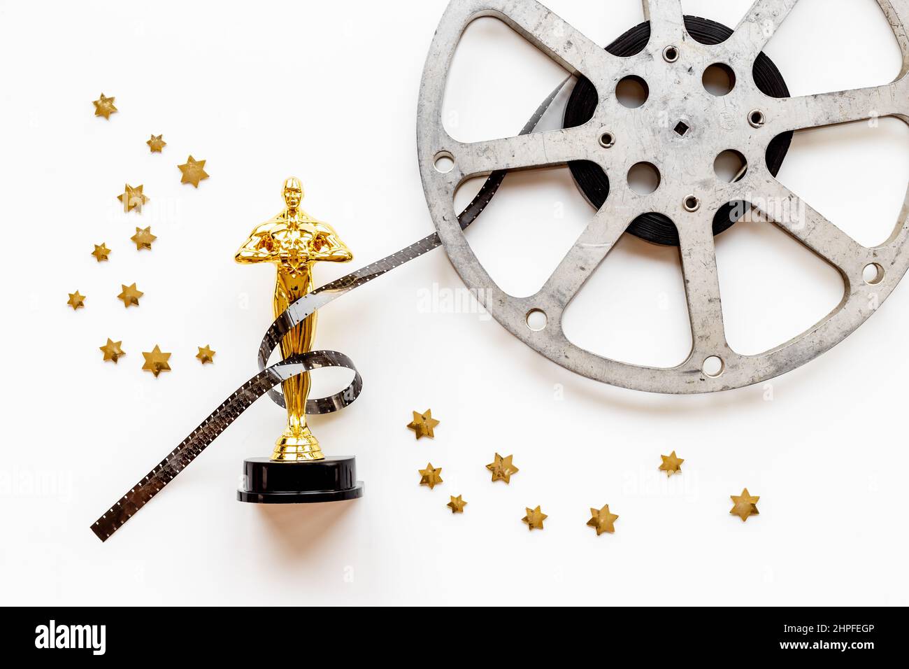 Golden movie award statue with stars - best film winner Stock Photo - Alamy