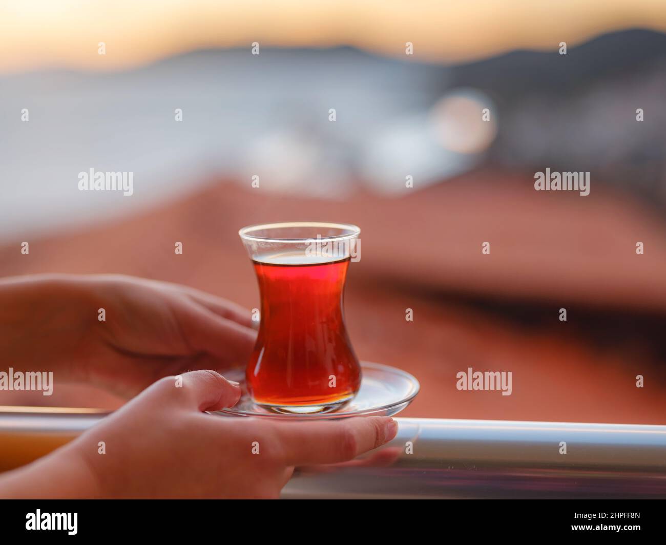 Woman drinking turkish tea from traditional turkish teacup and enjoys ...