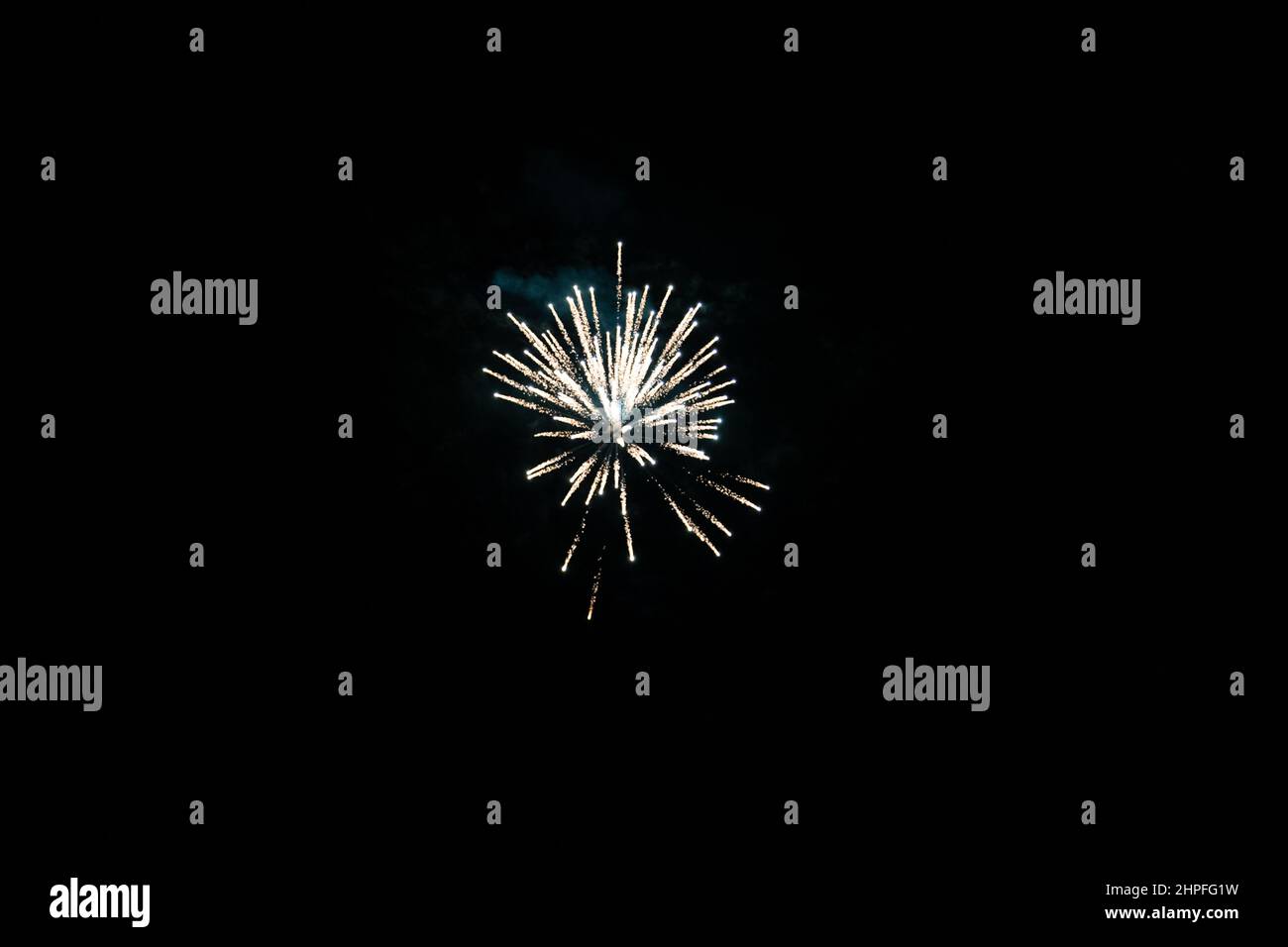 single explosion of one firework in the distance Stock Photo - Alamy