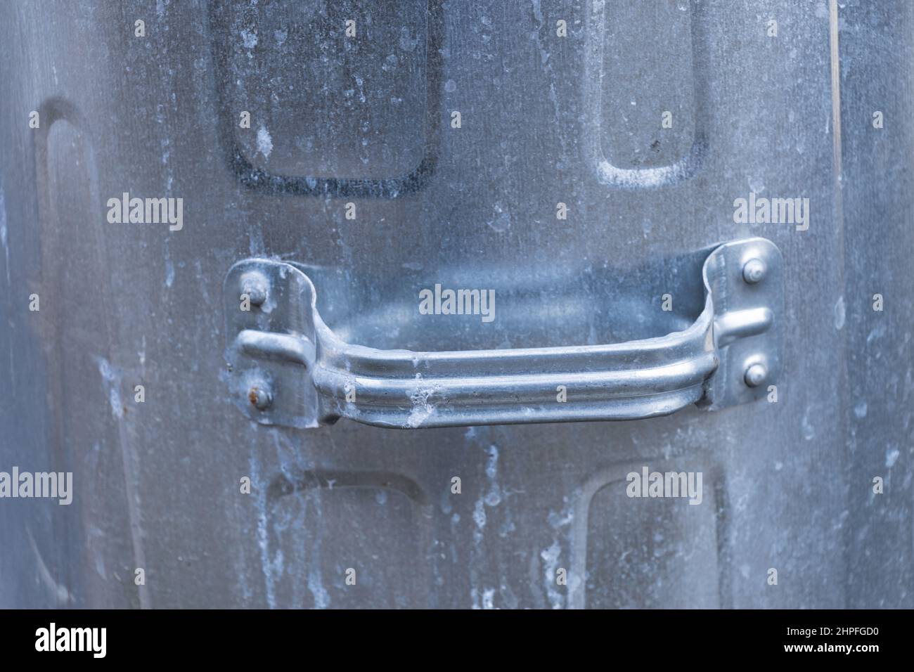 detail of the side handle from a tin bin Stock Photo - Alamy