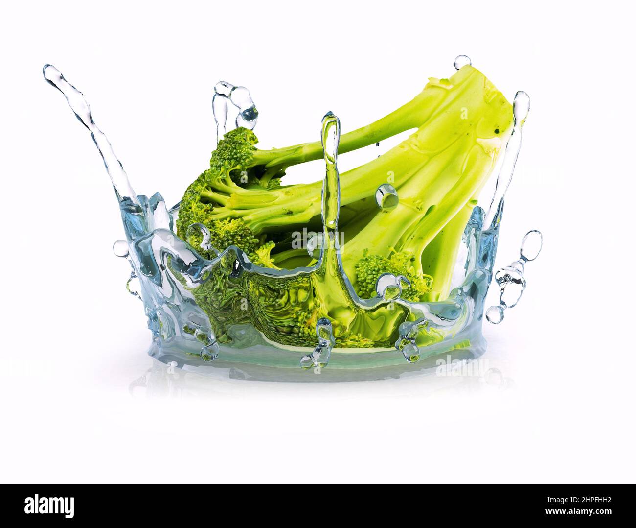 Broccoli in water splash isolated on white background Stock Photo - Alamy