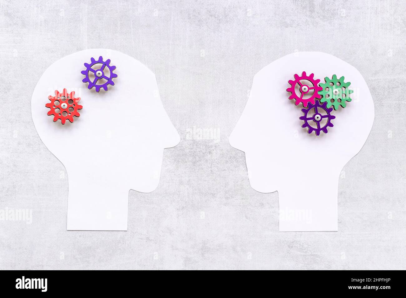Brain gears on two human heads. Mind work. Brain chaos and mind peace ...