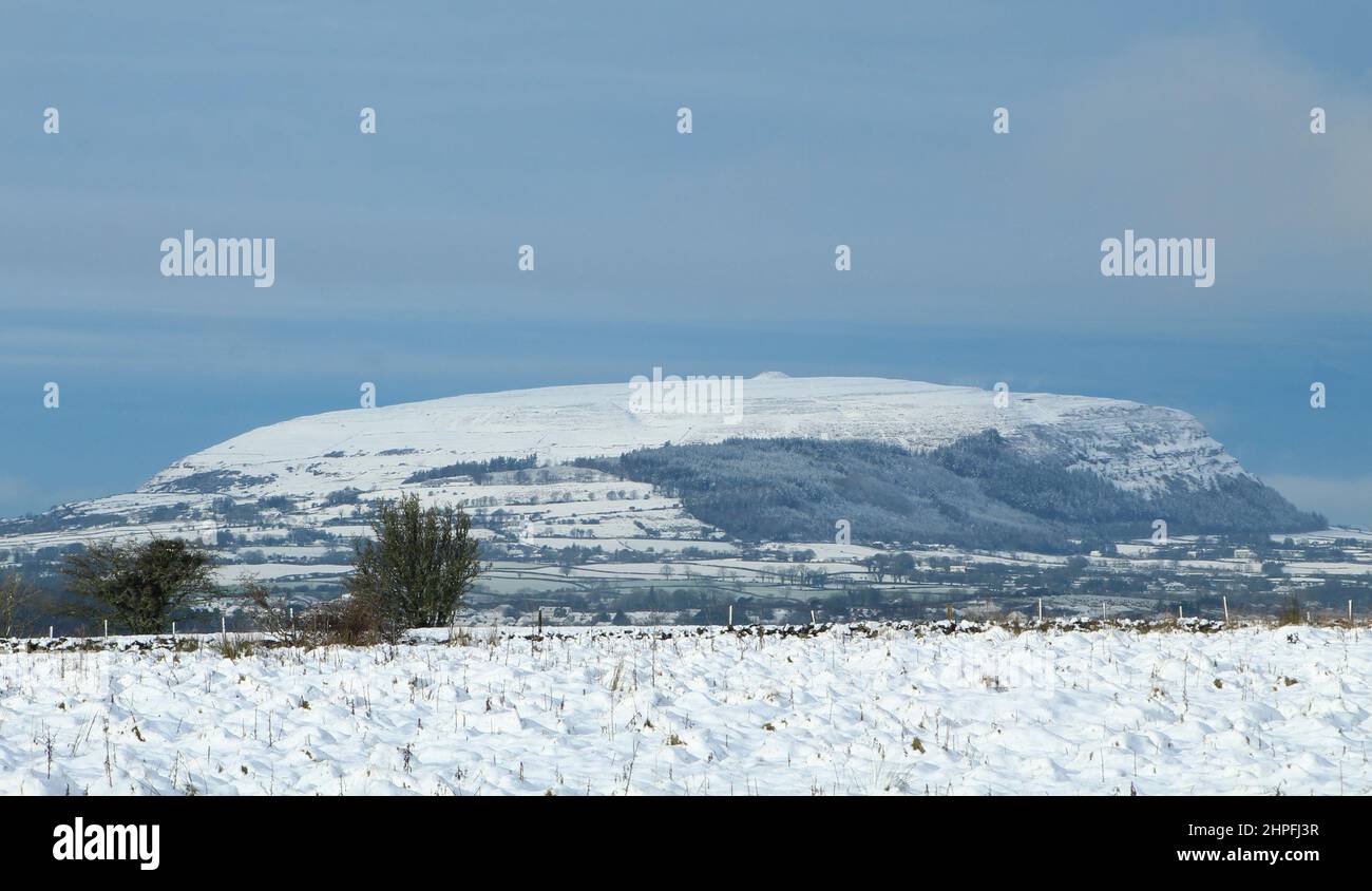 Snow-covered Knocknarea mountain in County Sligo, Ireland in wintertime ...