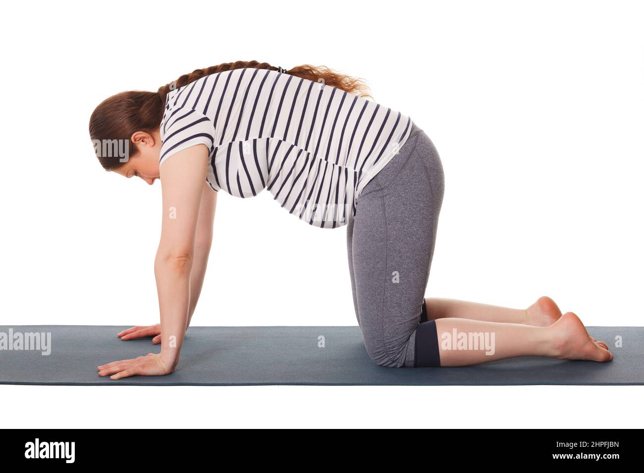 Pregnant woman doing yoga asana Marjaryasana cat pose Stock Photo - Alamy