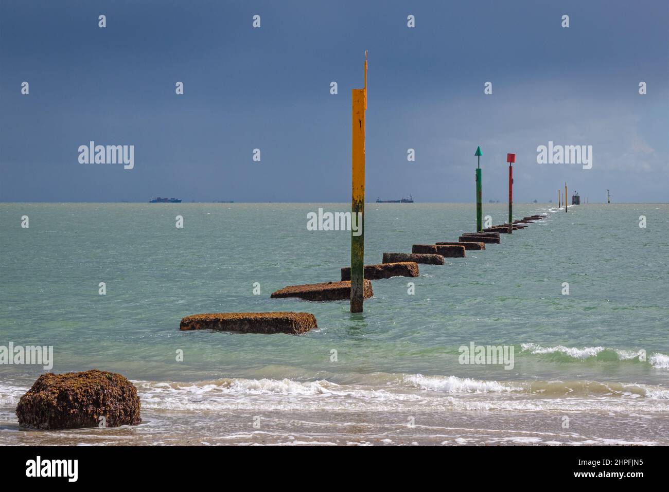 A line of large concrete blocks running out from the beach at Southsea ...