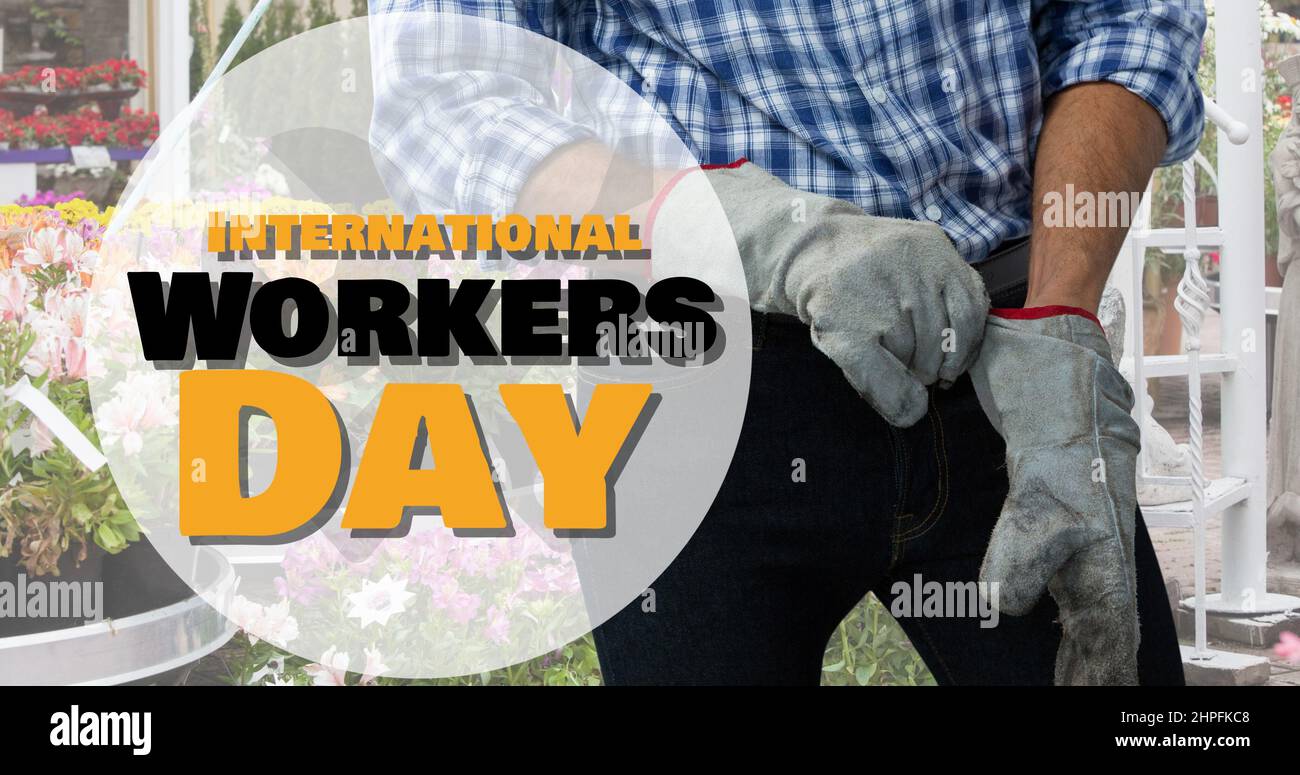 International workers day text symbol over midsection of caucasian ...
