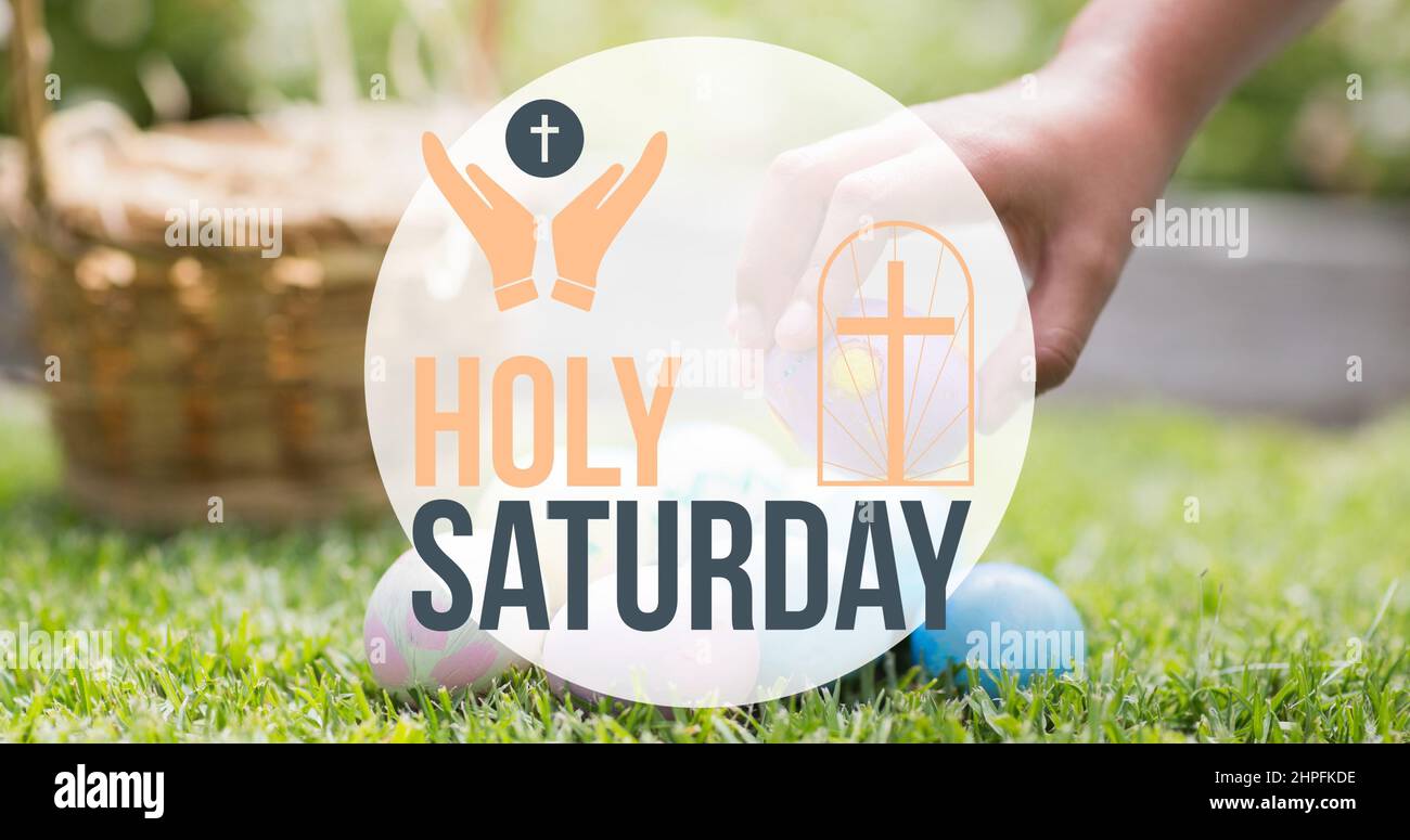 Holy saturday symbol text over person holding easter eggs on grass at ...