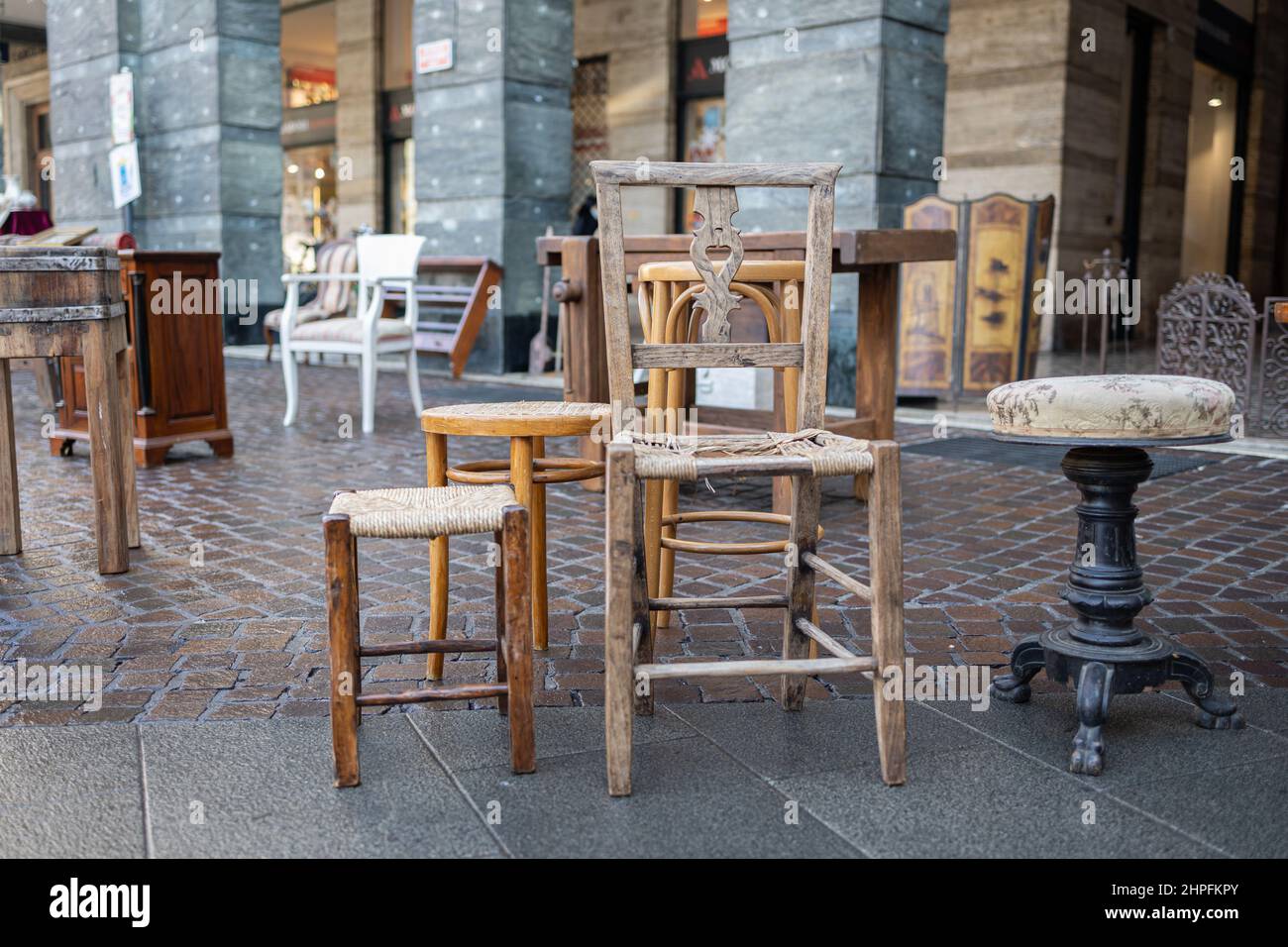 Antique Wooden Stuffed Chair and Small Benches for Sale on the Street ...