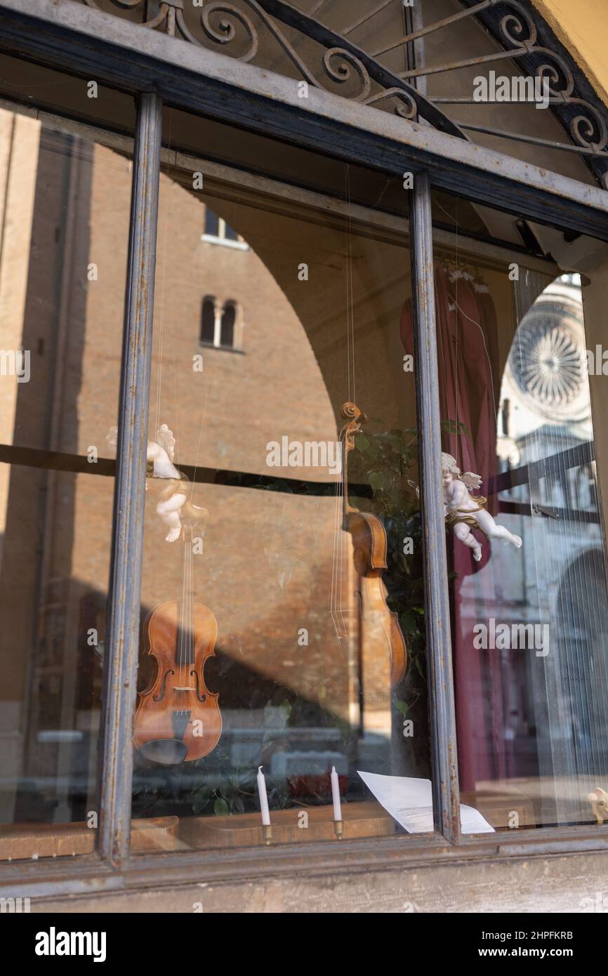 Store Window of a Luthier's Shop: Handmade Violins on Display and ...