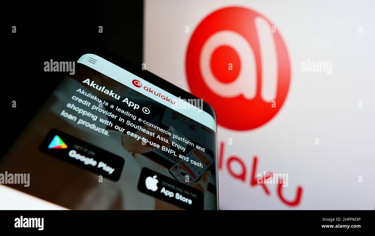 Mobile phone with webpage of Asian financial company Akulaku Inc. on ...
