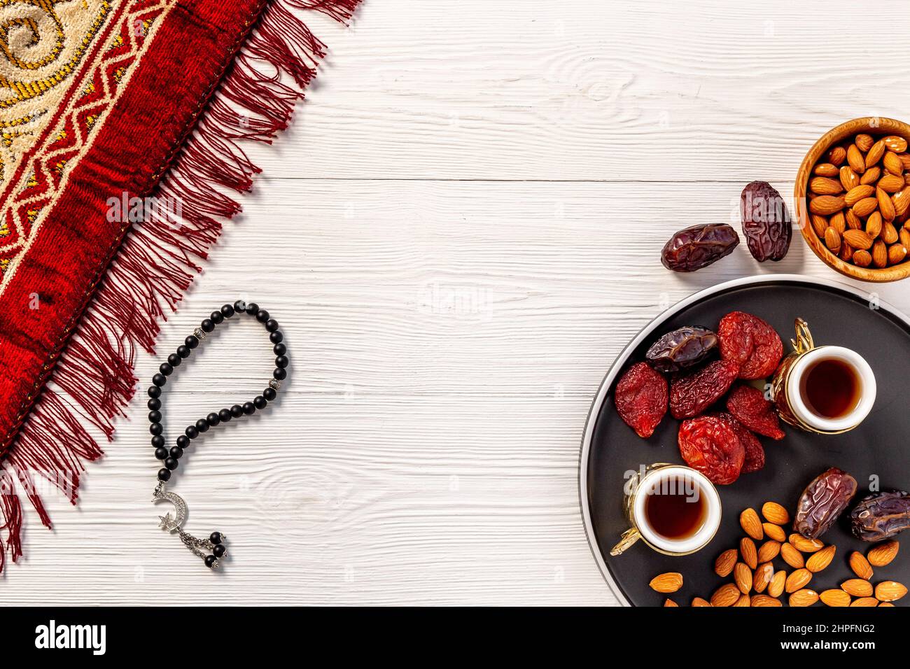 Ramadan background - Islamic prayer carpet with dates and rosary Stock ...