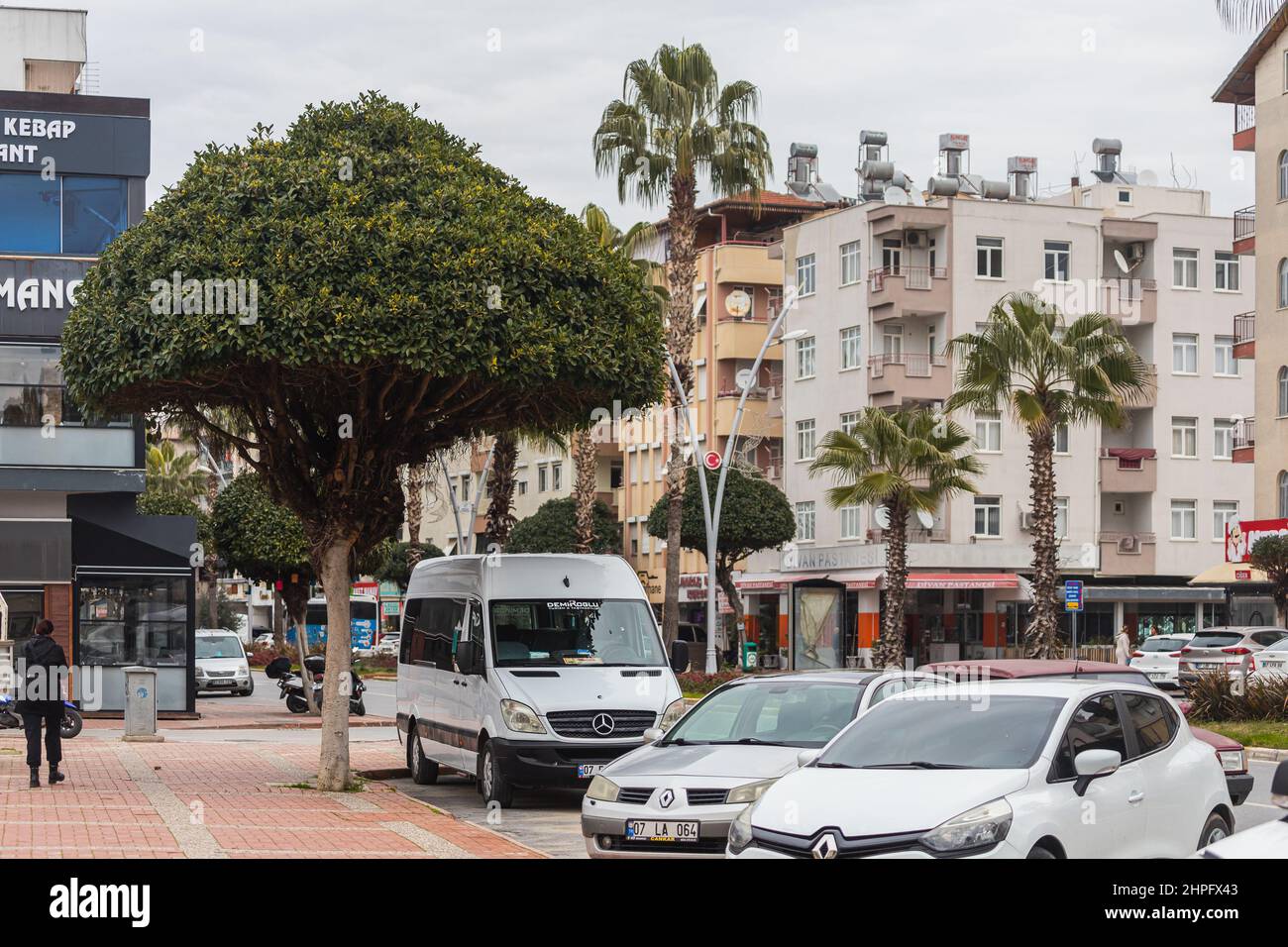 Side, Turkey -January 29, 2022: City street , cars parking and people ...
