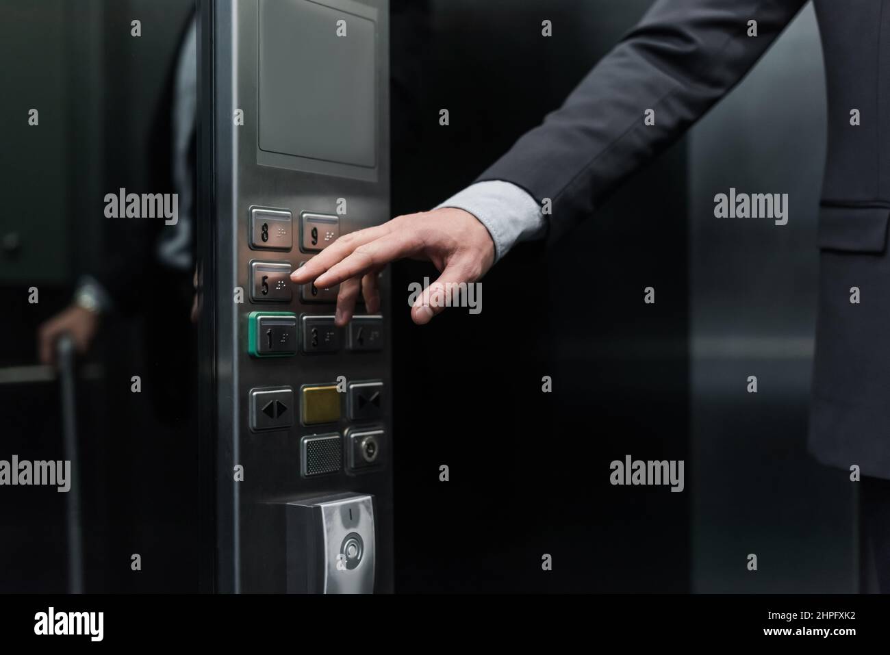 cropped view of man pressing button in modern elevator Stock Photo - Alamy