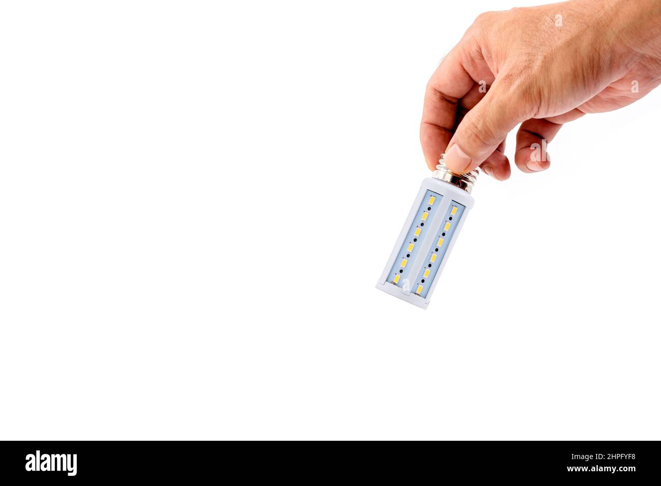 Human hand holding LED light bulb isolated on white background Stock ...