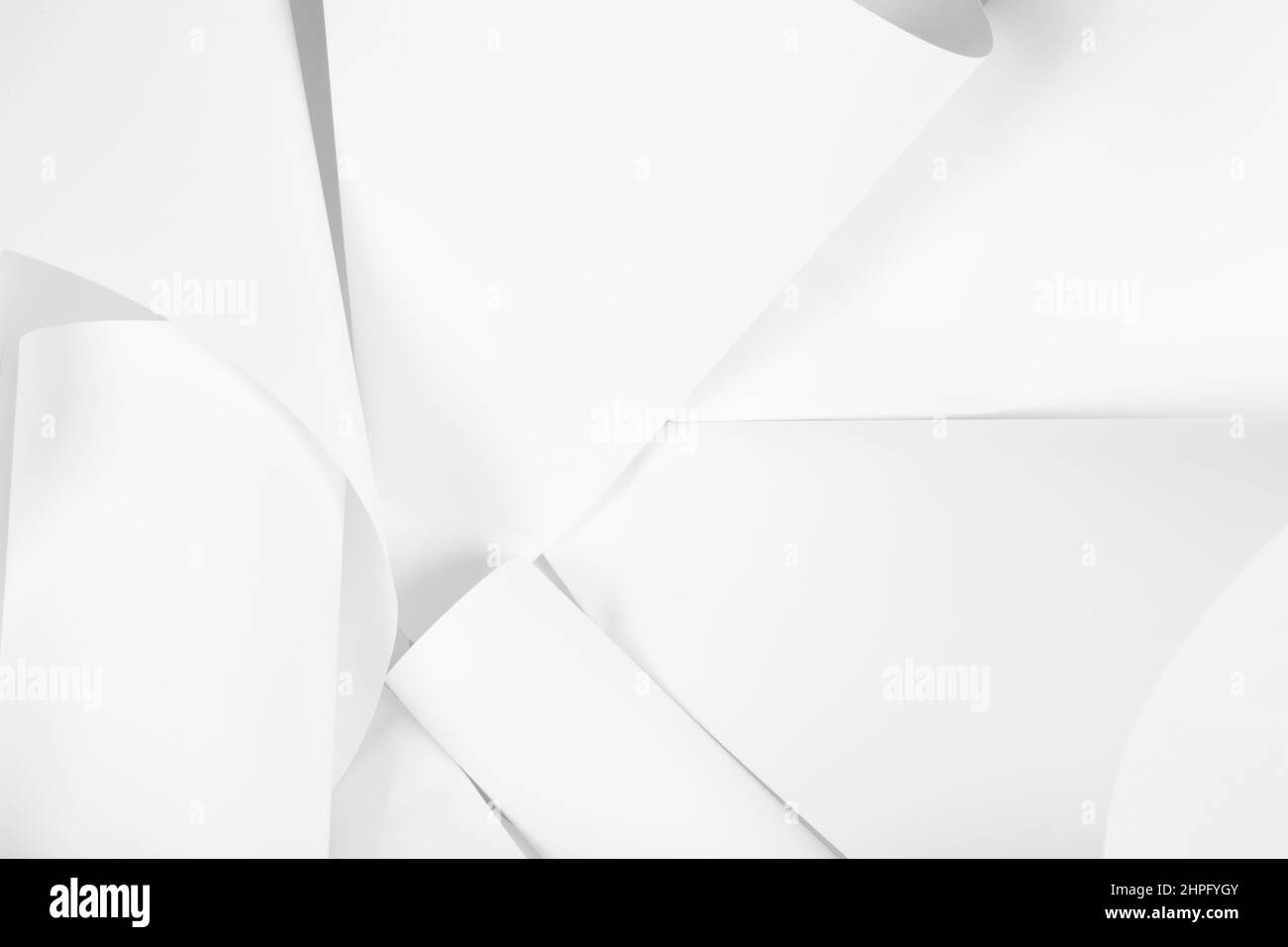 White sheets of office paper are twisted and scattered. Paper white ...