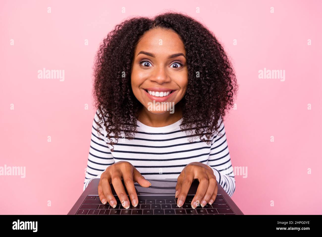 Portrait of cheerful pretty girl write email toothy smile look camera ...