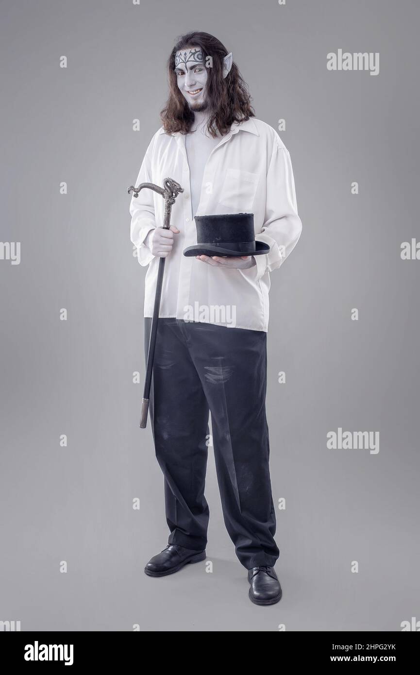 Fantasy Illusionist Performer. Body painted performer in black and ...