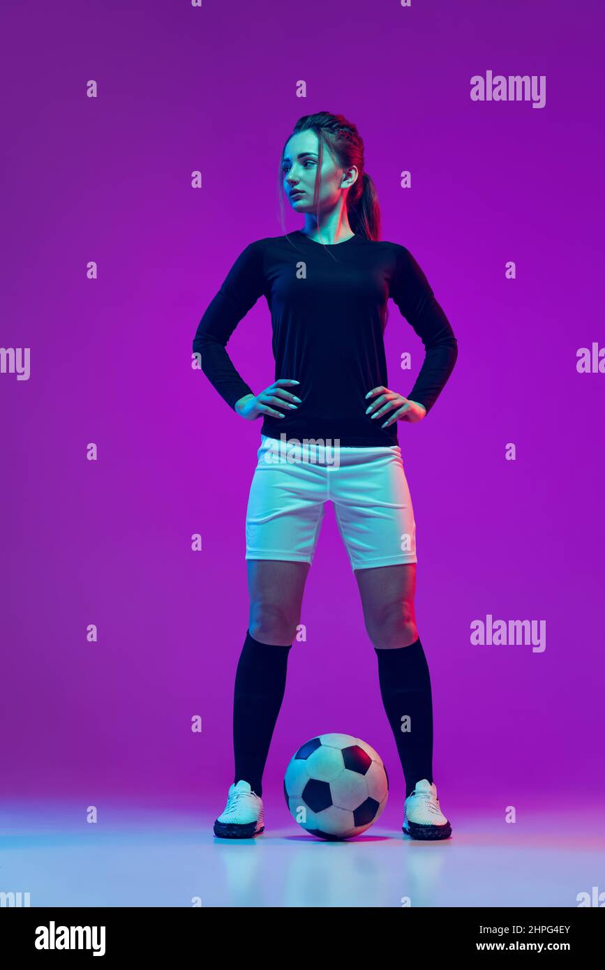 Portrait of beautiful girl, professional female soccer player posing ...