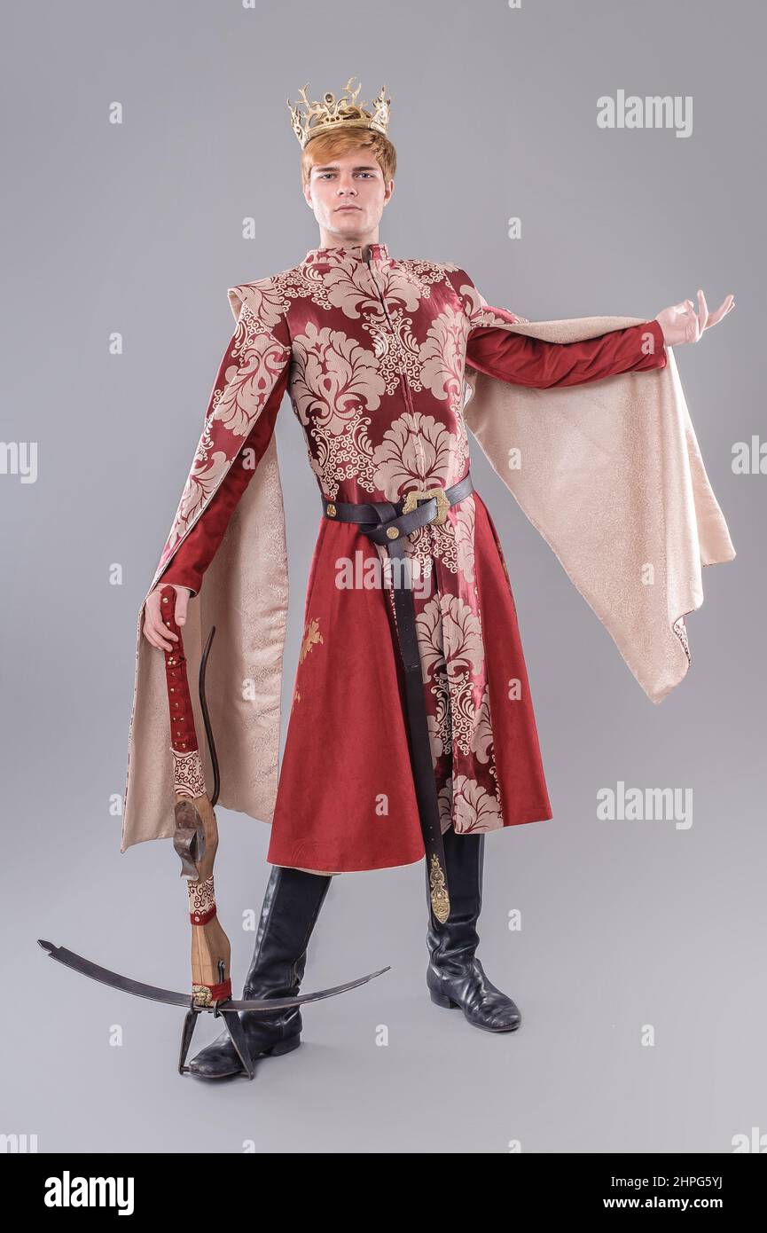 Medieval king with sword and crown Stock Photo - Alamy