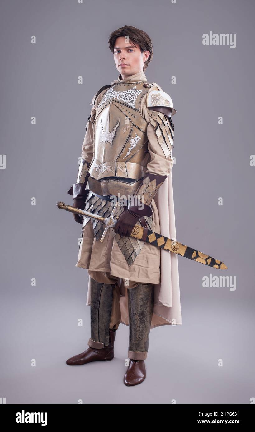 Medieval knight in armor with a sword Stock Photo - Alamy