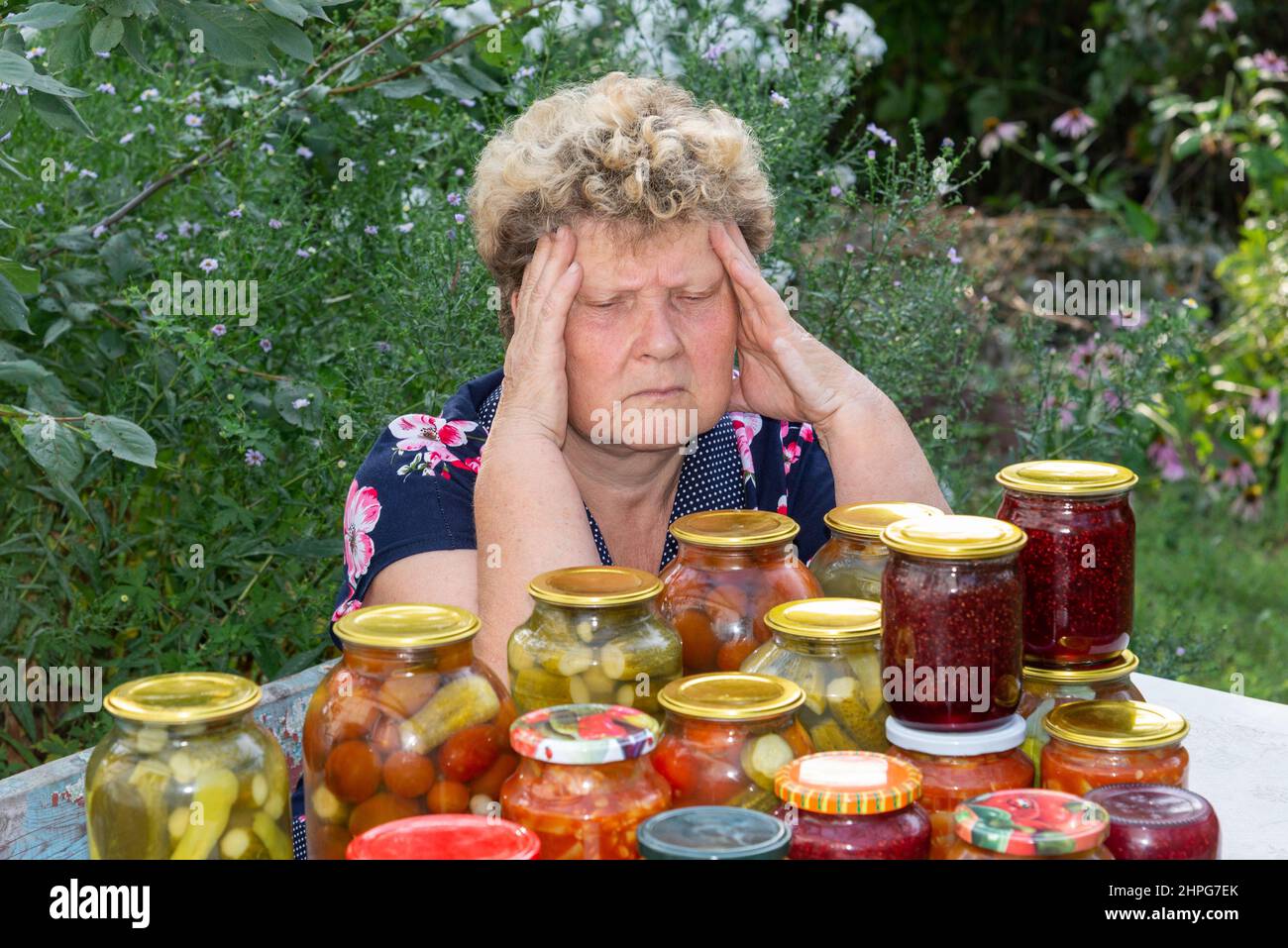 Woman with a homemade canned vegetables Stock Photo - Alamy