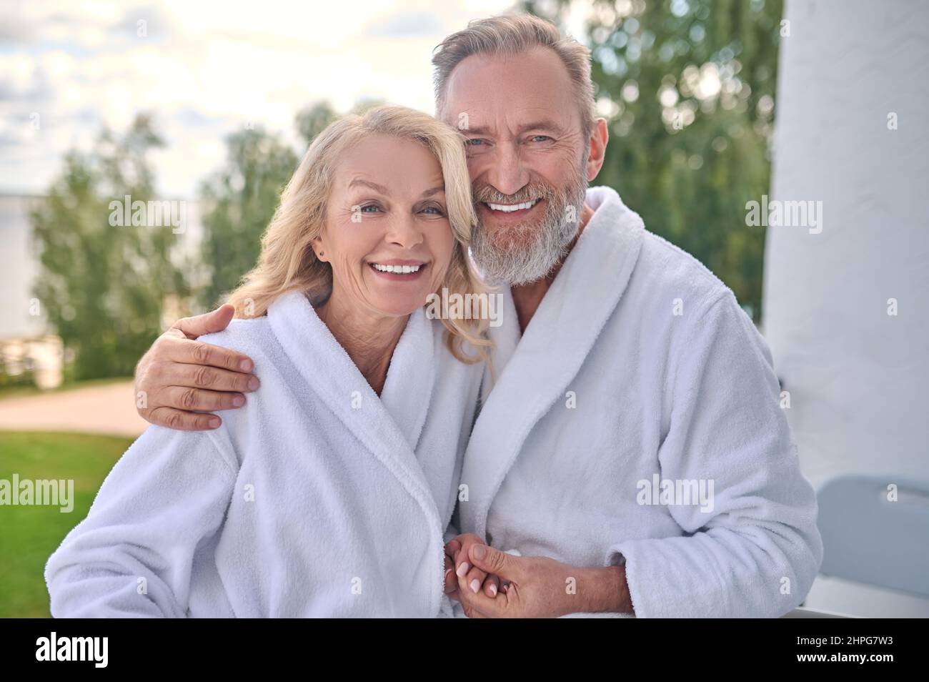 A happy mid aged couple at the balcony Stock Photo - Alamy