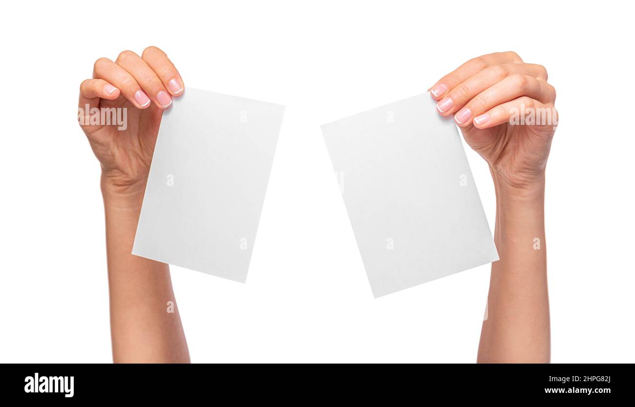 Hand holding white cards on white Stock Photo - Alamy