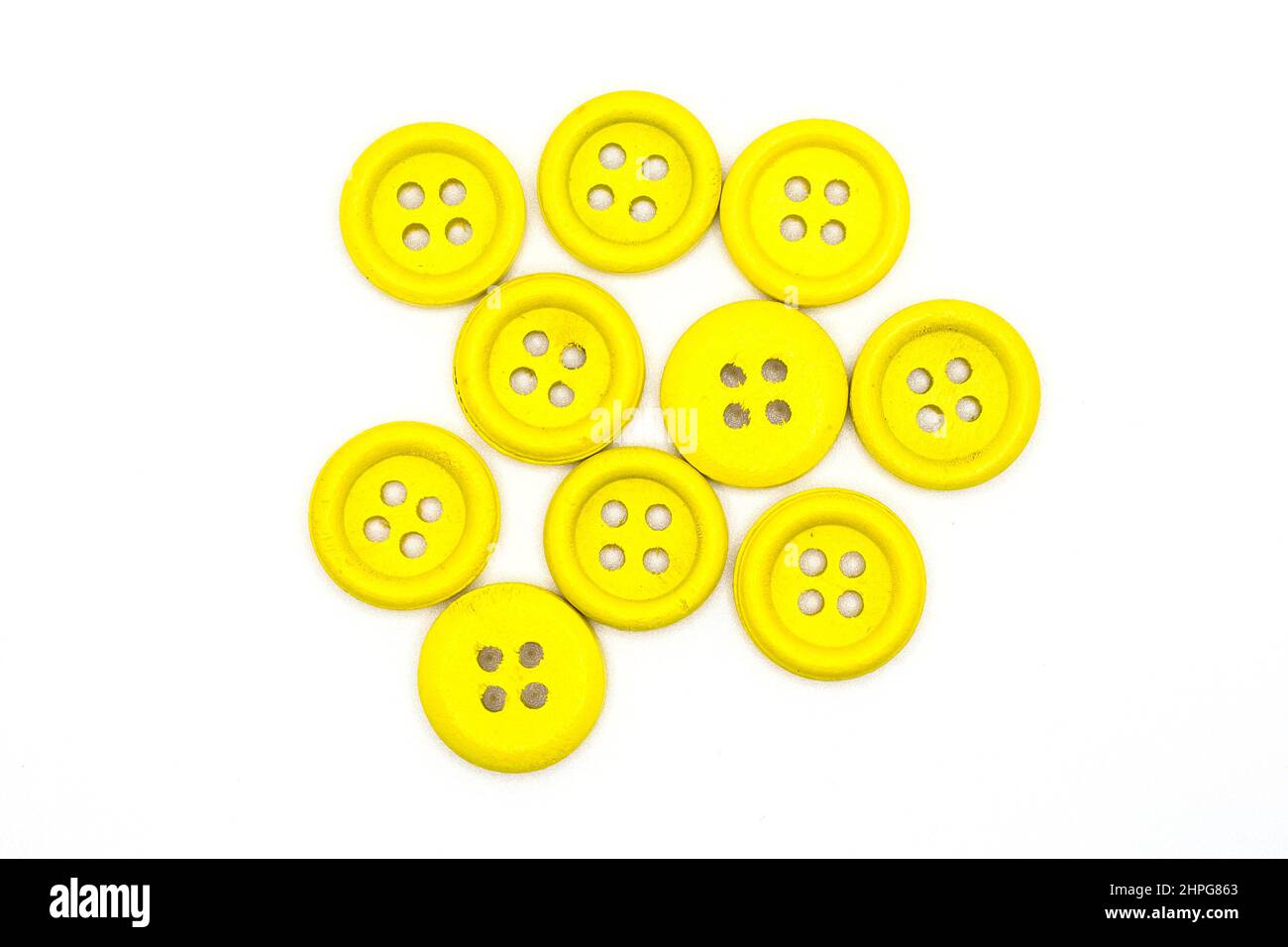 Yellow bright small buttons on a white background, isolated Stock Photo ...