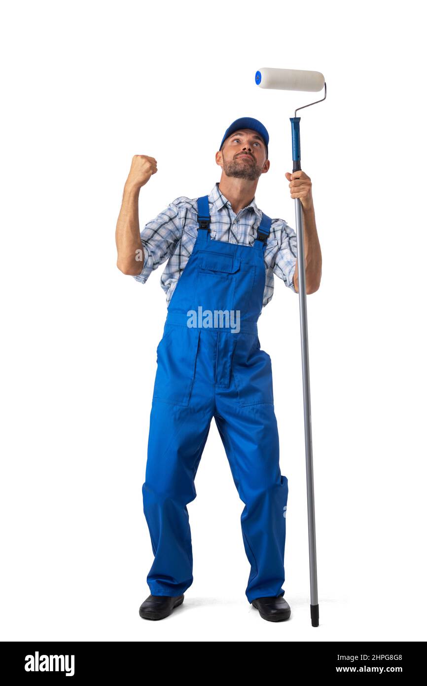 Mid adult professional house painter man in uniform with paint roller ...