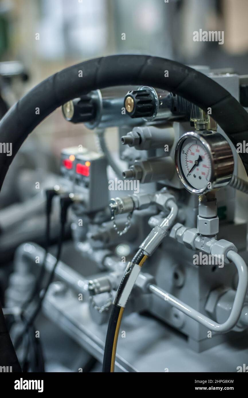 Mechanic automatic pump working at the factory. Industrial interior and ...