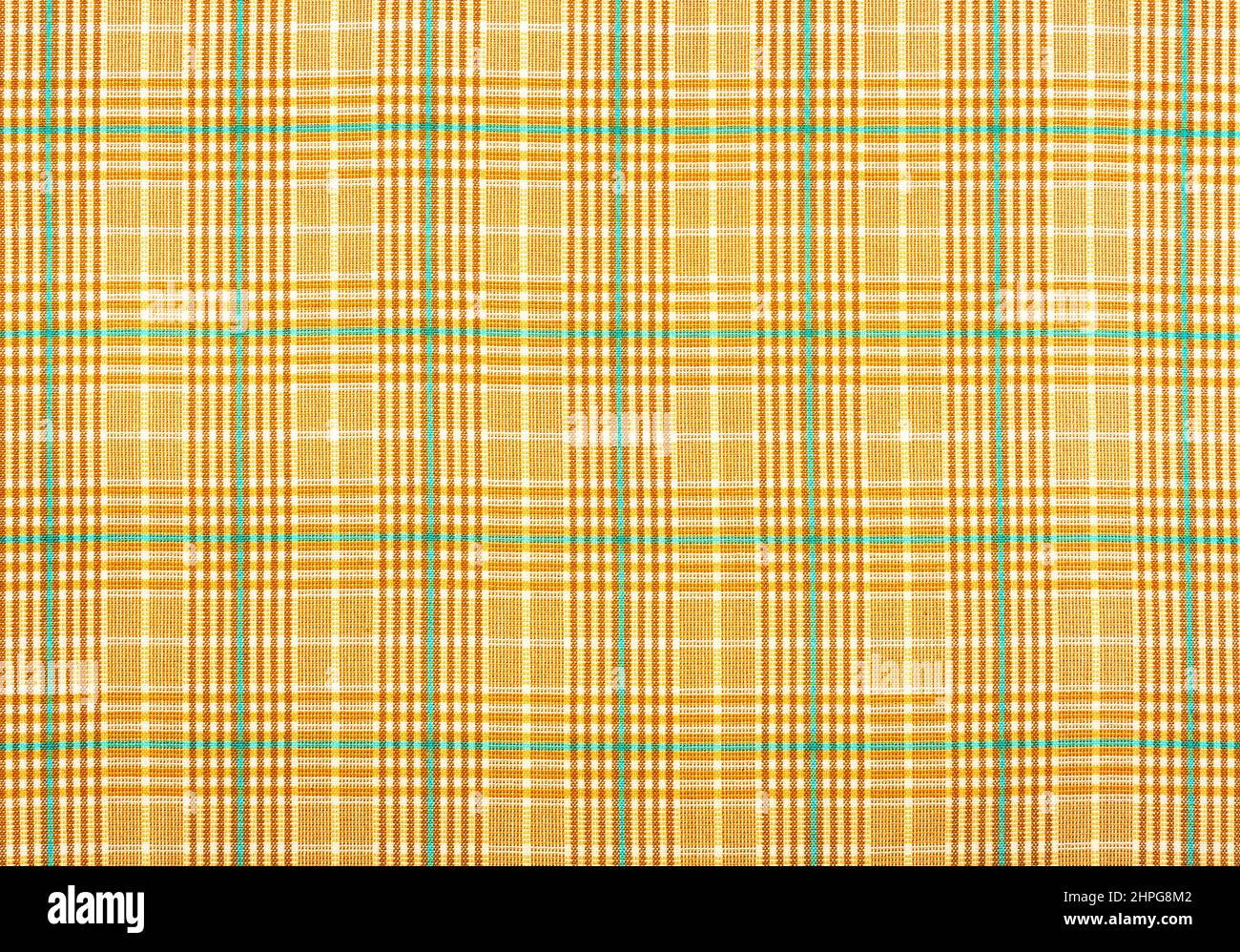 Checkered fabric in yellow or brown. Background from checkered fabric ...
