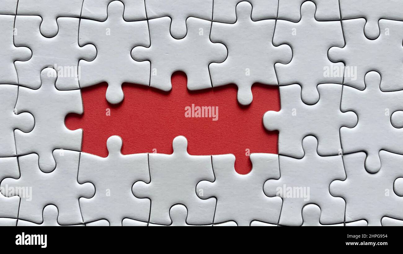 Top view of missing jigsaw puzzle with red color background Stock Photo ...