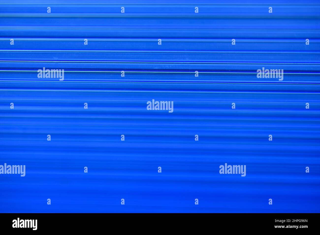 Blue bright stripes of polycarbonate in the light Stock Photo - Alamy