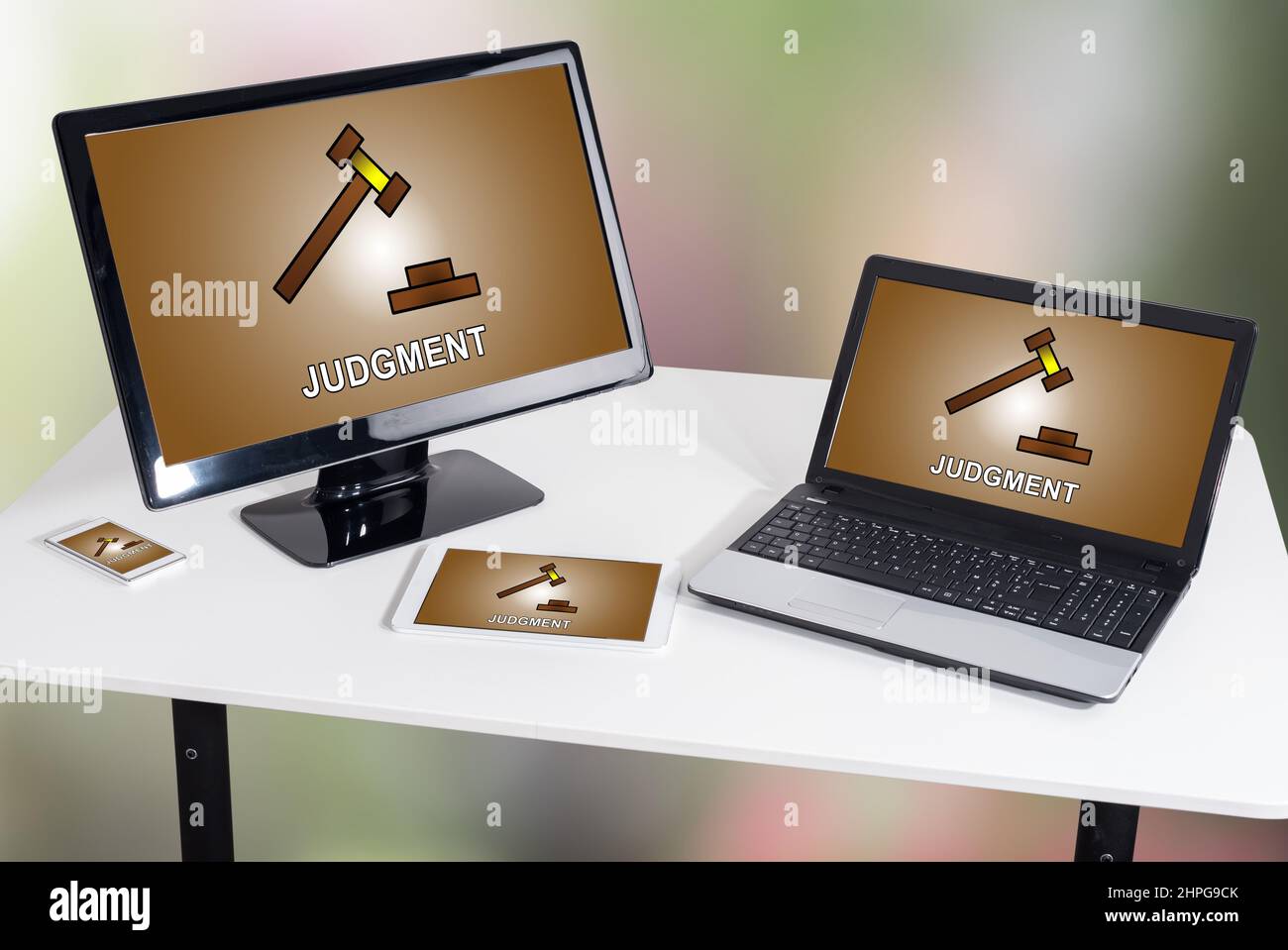 Judgment concept shown on different information technology devices ...