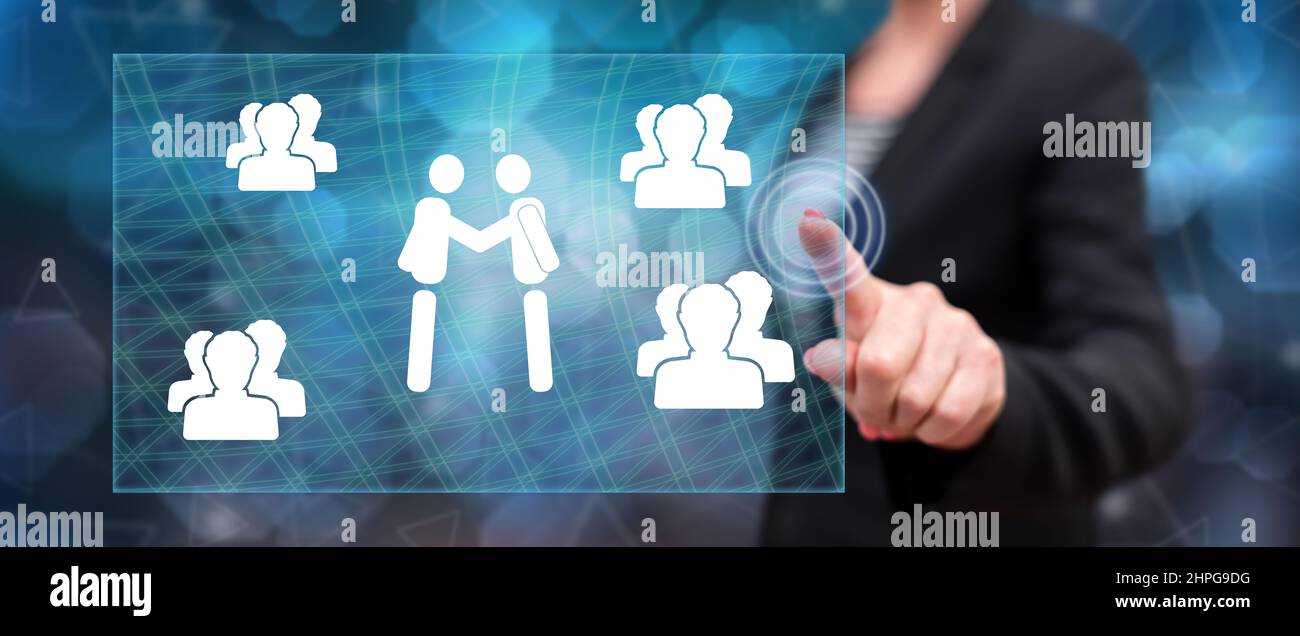 Woman touching a business partnership concept on a touch screen with ...