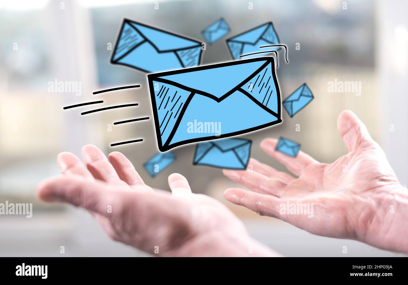 E-mail concept above the hands of a man Stock Photo - Alamy