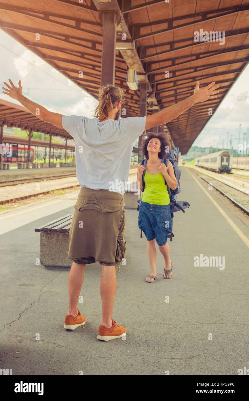 Man meeting his girlfriend from her trip at the train station Stock ...
